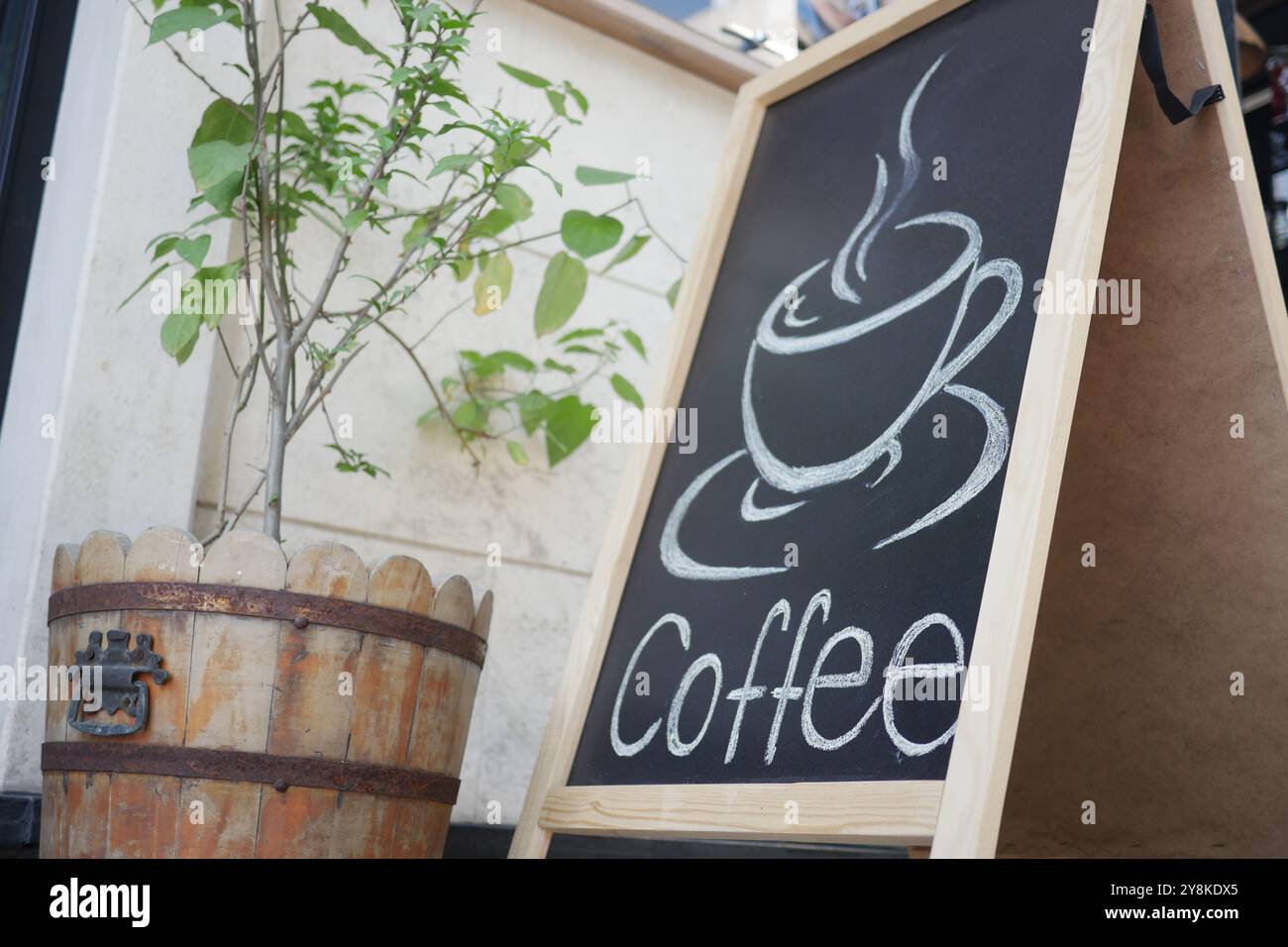 Charming Quaint Coffee Shop Sign Featuring a Beautiful Wooden Planter ...