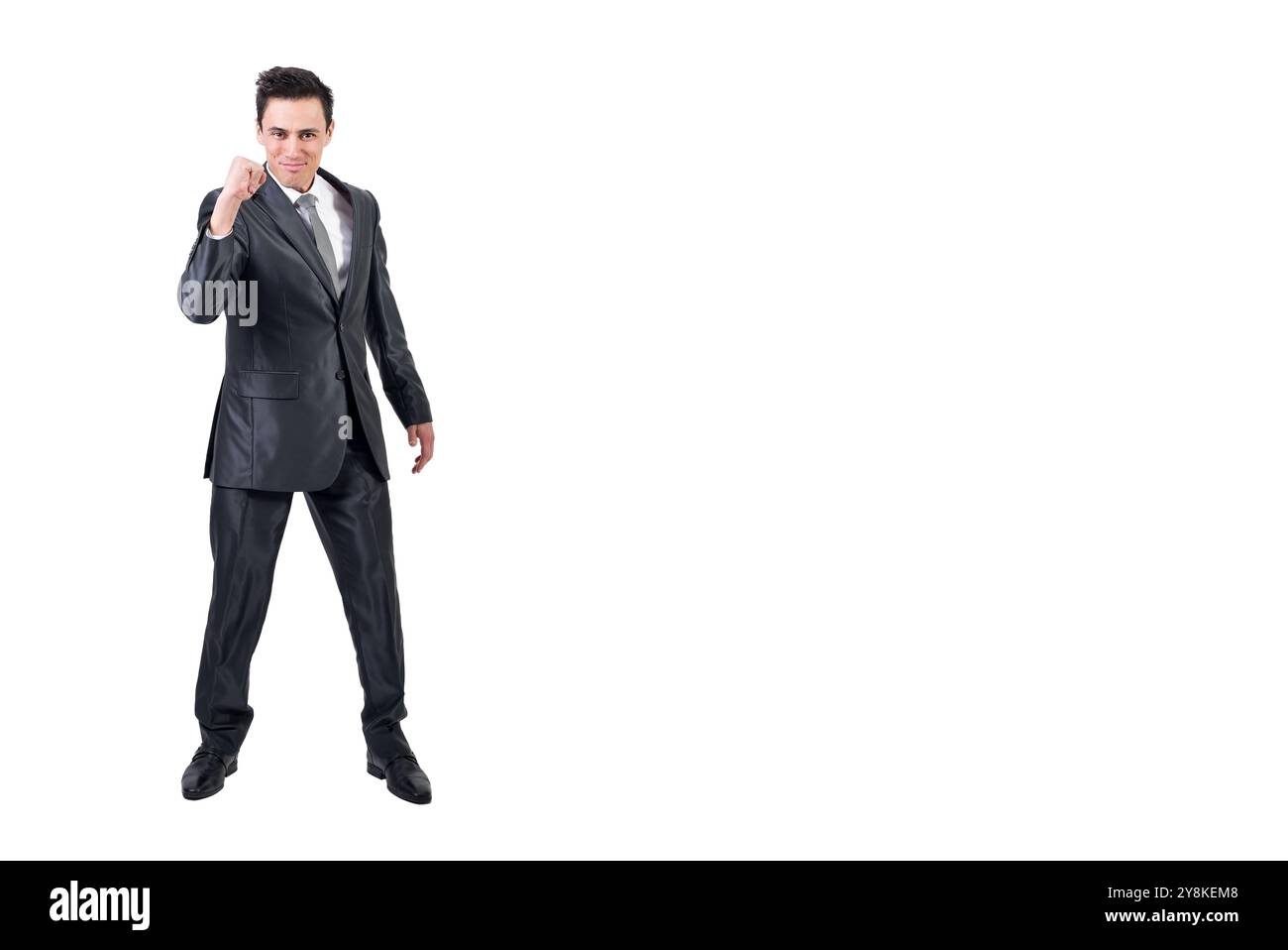 Gleeful man with clenched fist. White background Stock Photo - Alamy