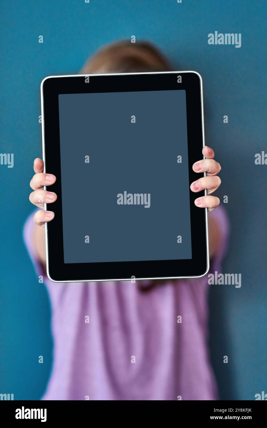 Hands, tablet and screen with child in studio with mockup space for app ...