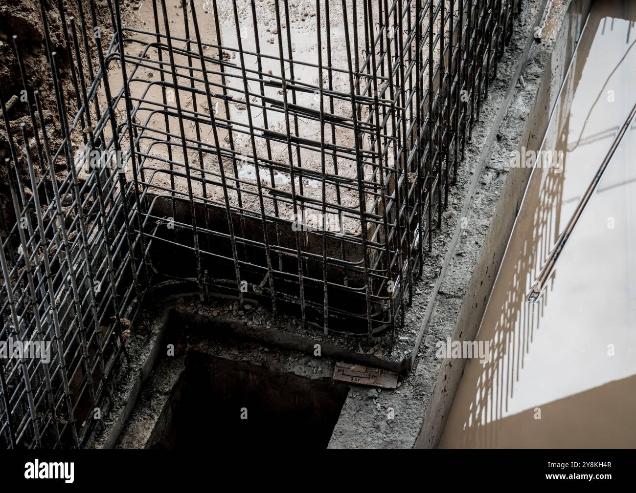 A construction site displaying a reinforced concrete foundation with ...