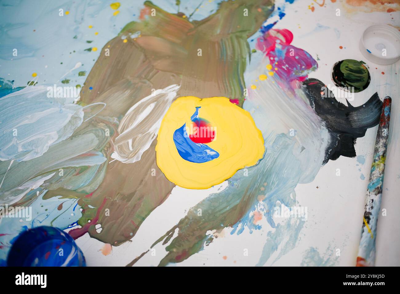 yellow, red, blue paint color ready for mixing on palette Stock Photo ...