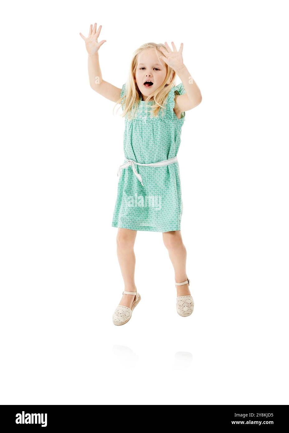 Studio, child and girl with energy for jump, hands up and fashion dress ...