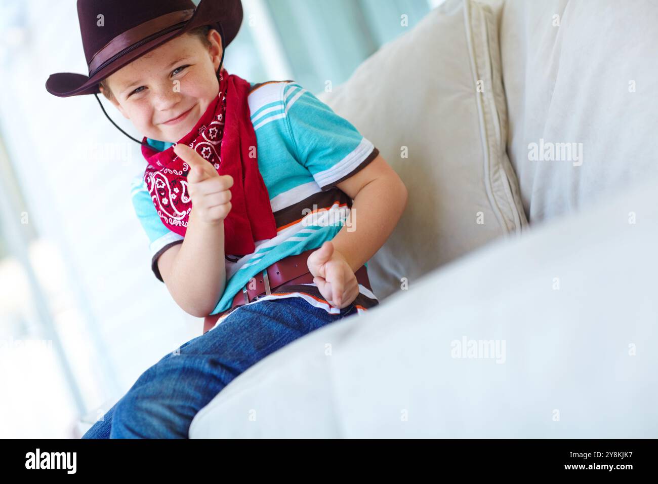 Happy kid, cowboy portrait and play with gun gesture for fantasy, game ...