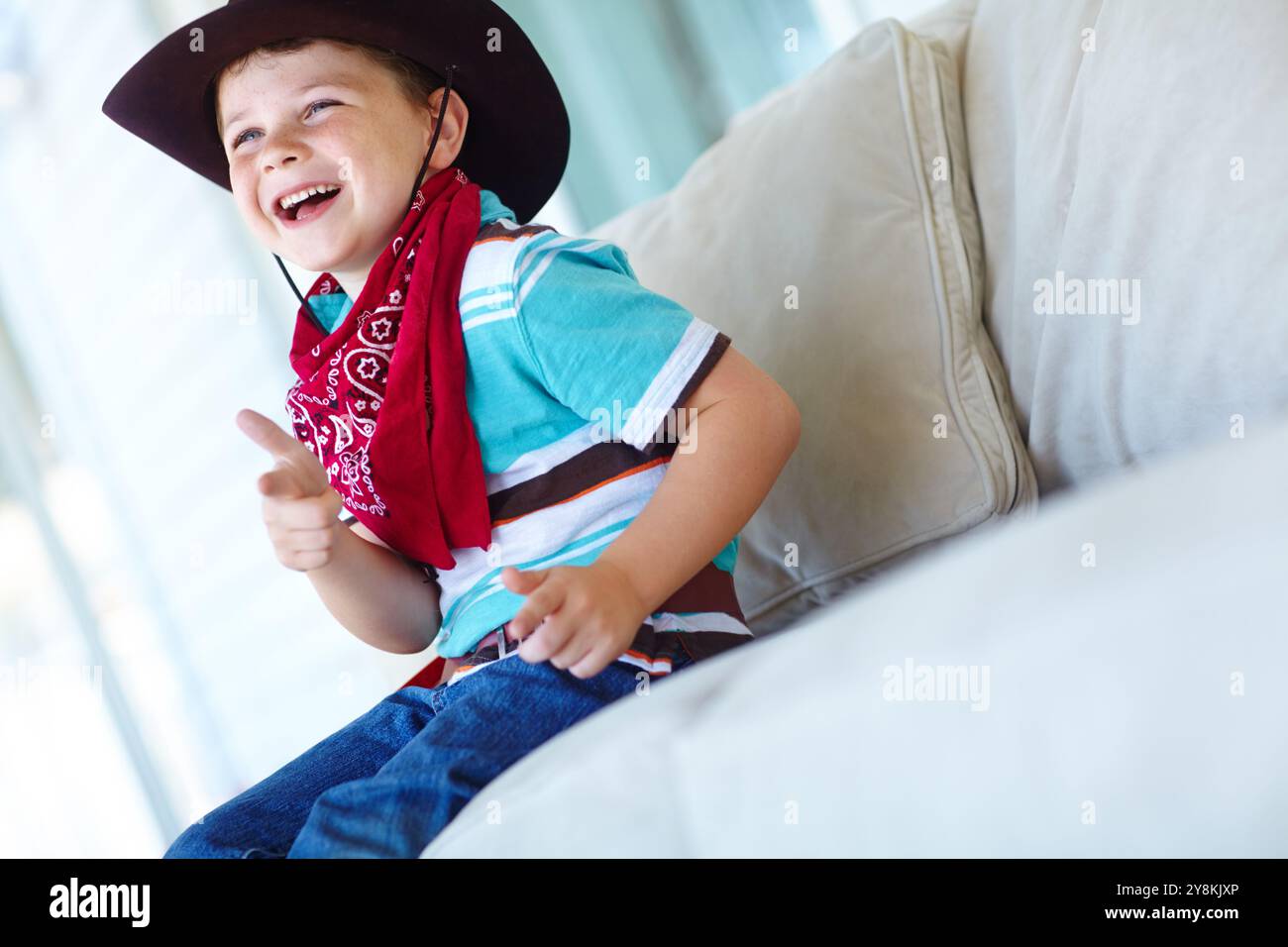 Boy, child and cowboy fashion in home, fantasy games and imagine ...