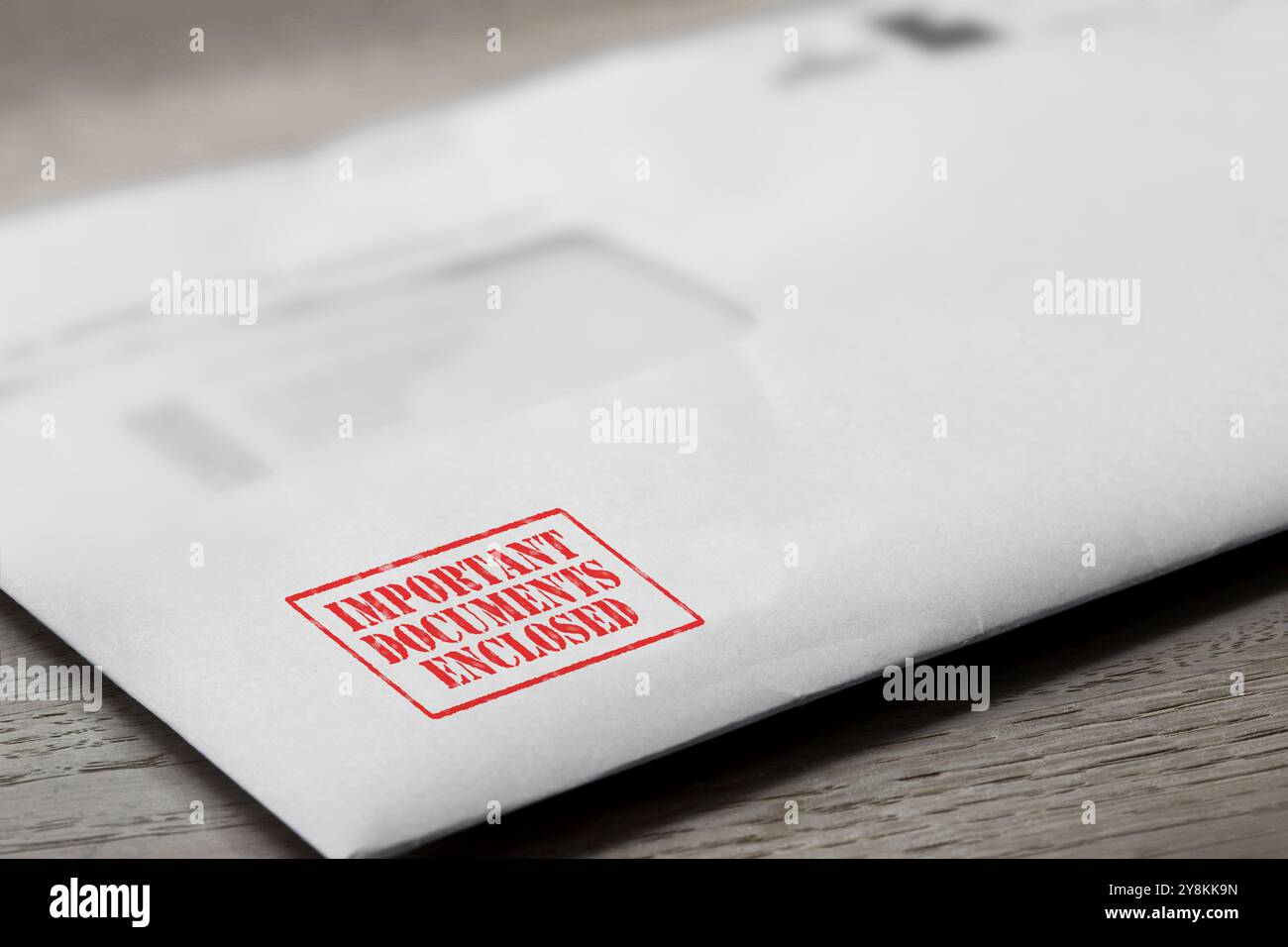 Important documents enclosed letter stamped in red on an envelope ...