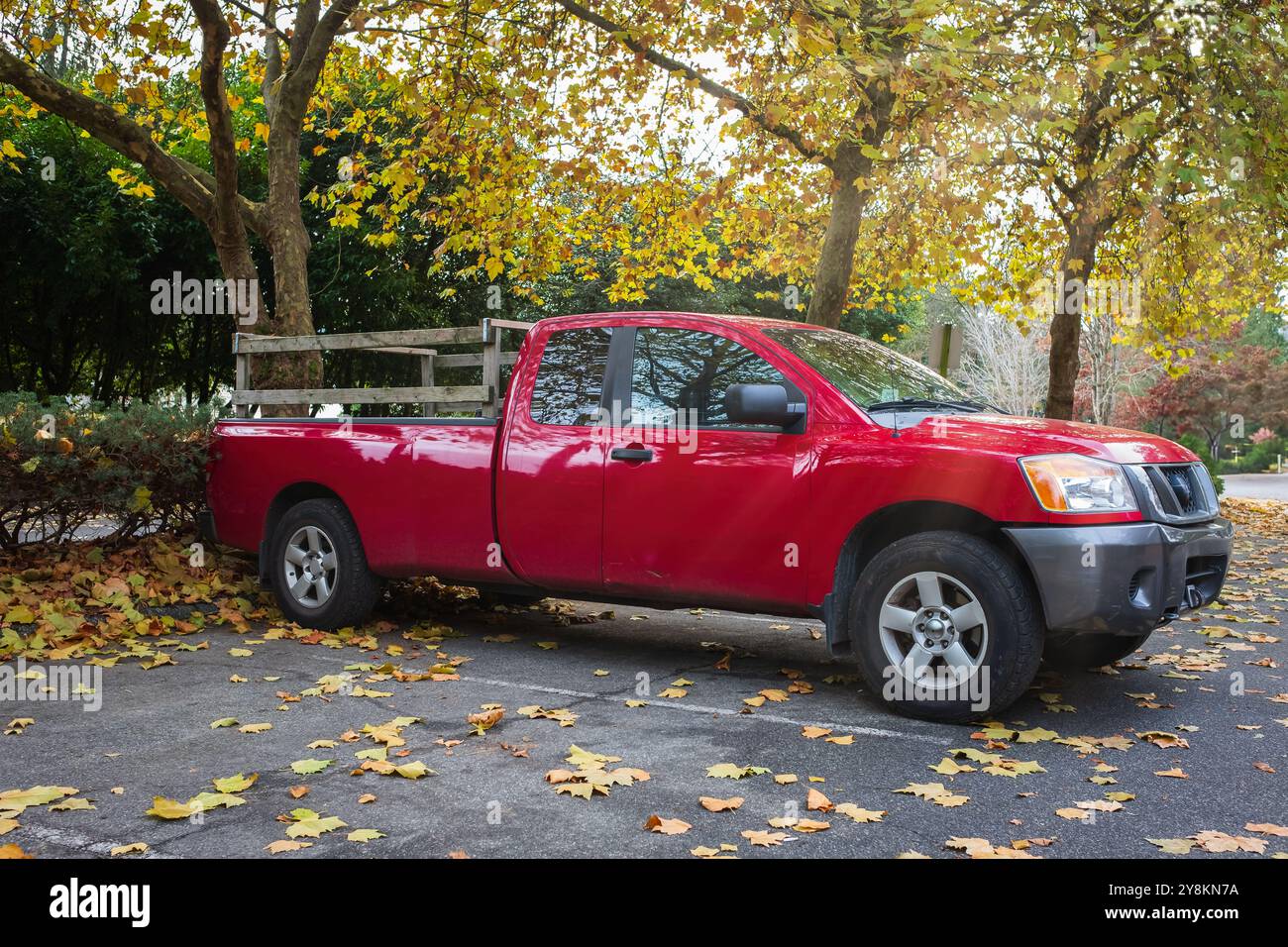 An old retro classic vintage red American pickup truck parked outside ...