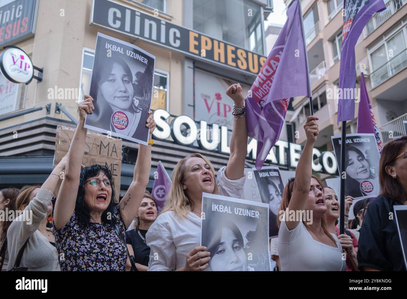 Izmir, Turkey. 05th Oct, 2024. Women hold Ikbal Uzuner's portraits ...