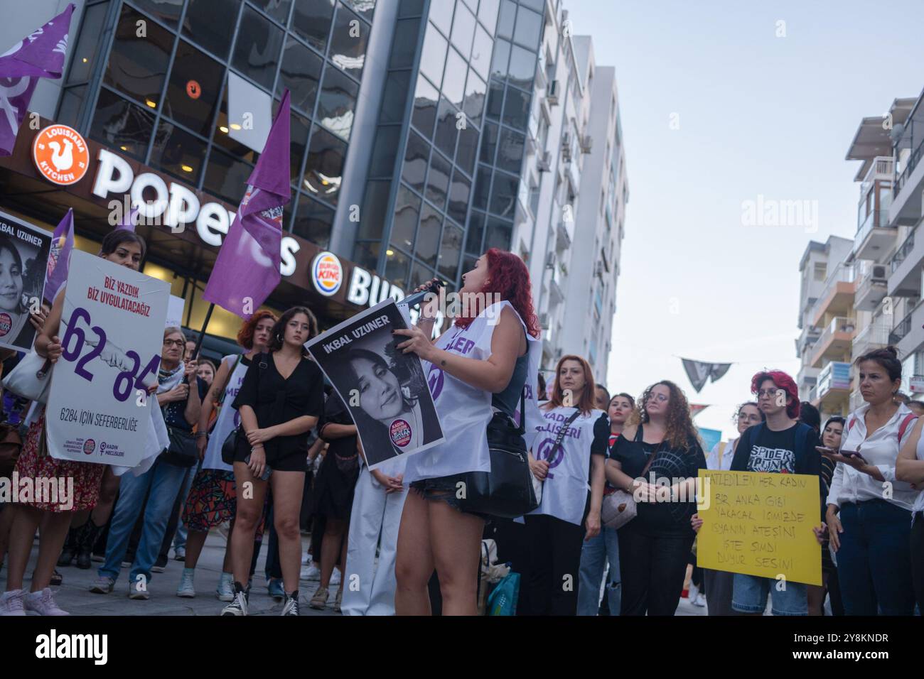 Izmir, Turkey. 05th Oct, 2024. Women hold Ikbal Uzuner's portraits ...