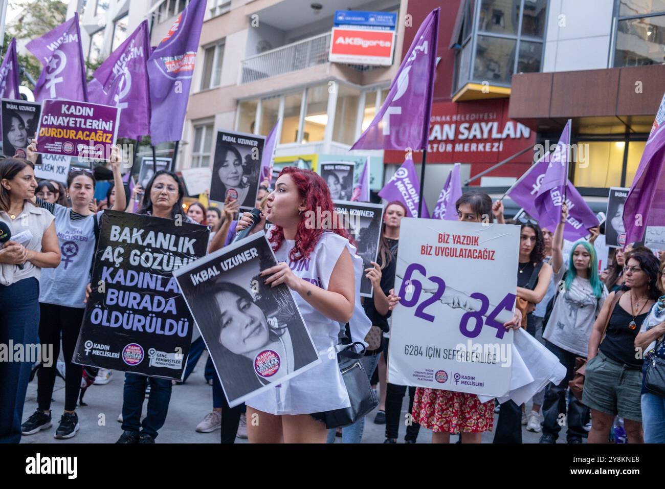 Izmir, Turkey. 05th Oct, 2024. Women hold Ikbal Uzuner's portraits ...