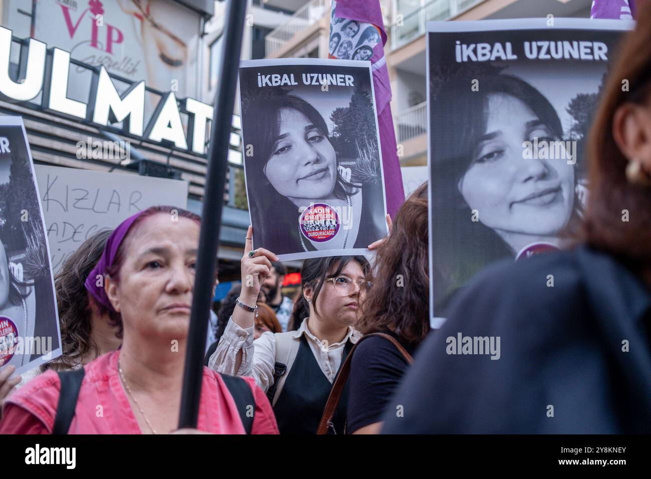 Izmir, Turkey. 05th Oct, 2024. Women hold Ikbal Uzuner's portraits ...