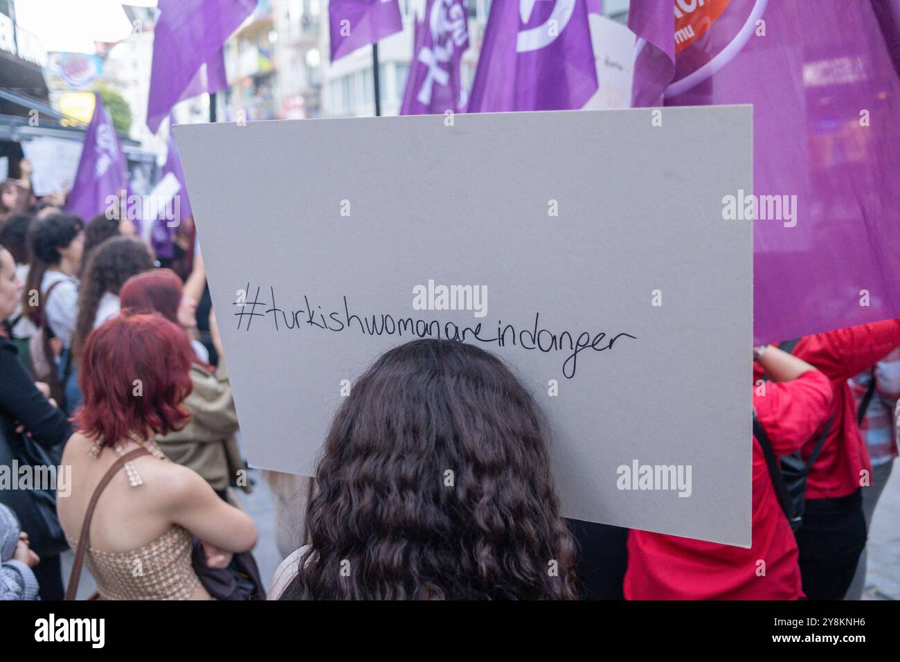 A woman holds a placard saying "Turkish Women Are In Dange" during the ...