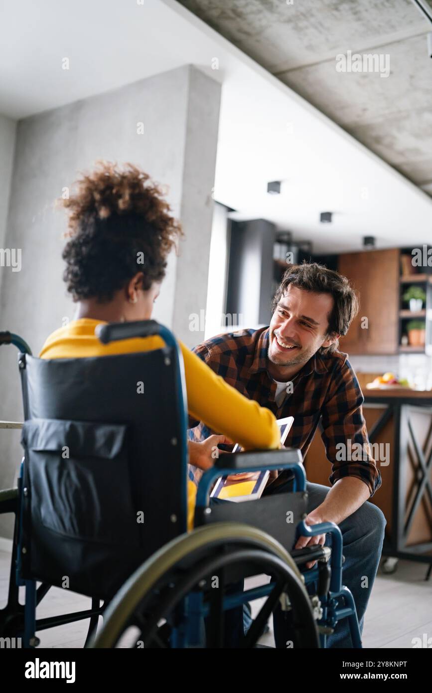 Happy multiethnic family with child with disability in wheelchair Stock ...