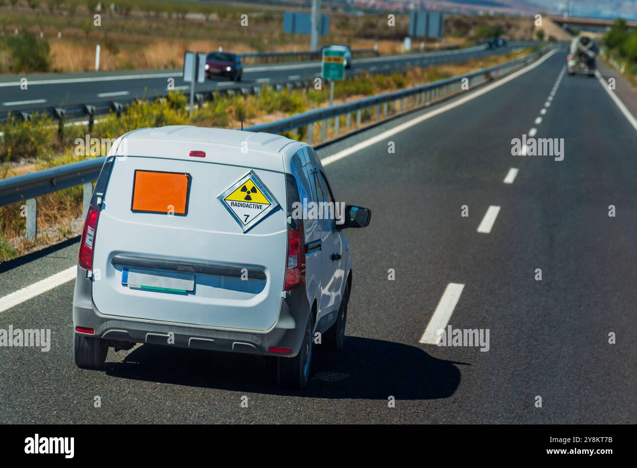 Van with orange ADR license plate and radioactive hazard label, number ...