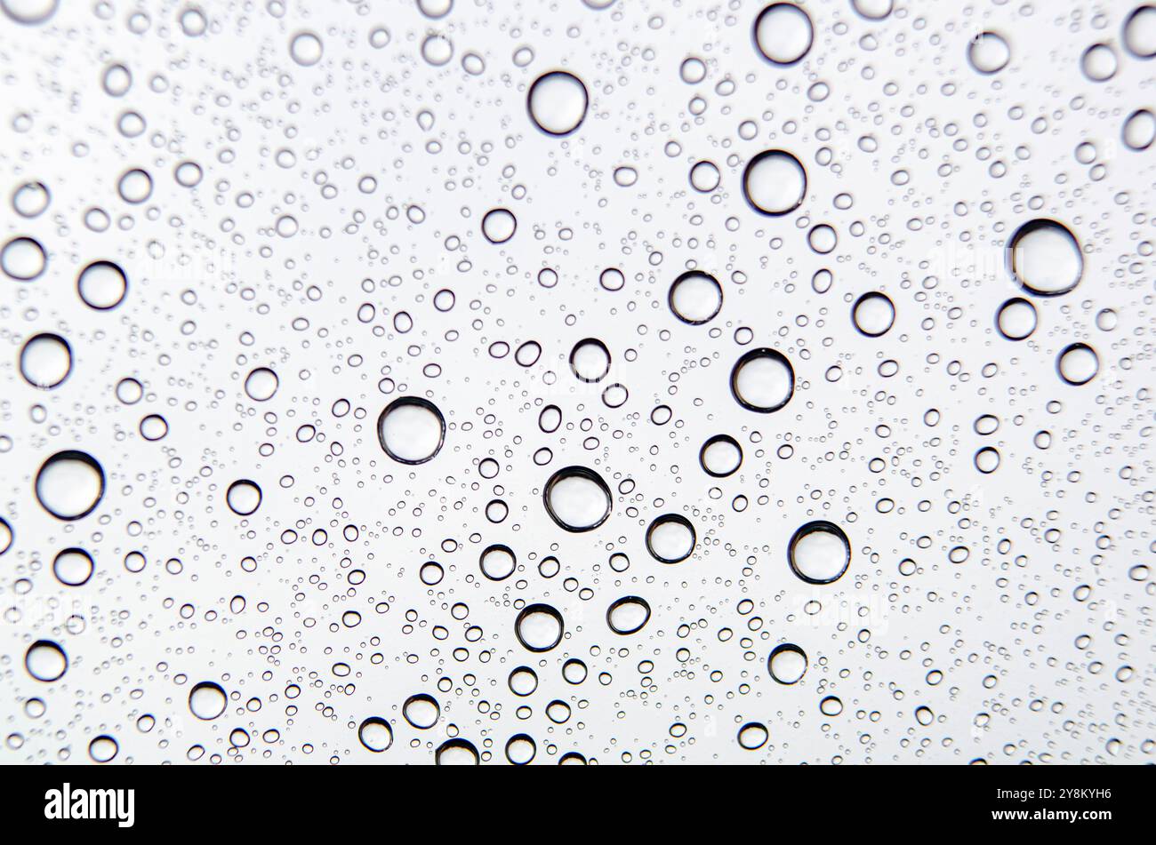 Close-up of water droplets scattered on a smooth surface. Hydration ...