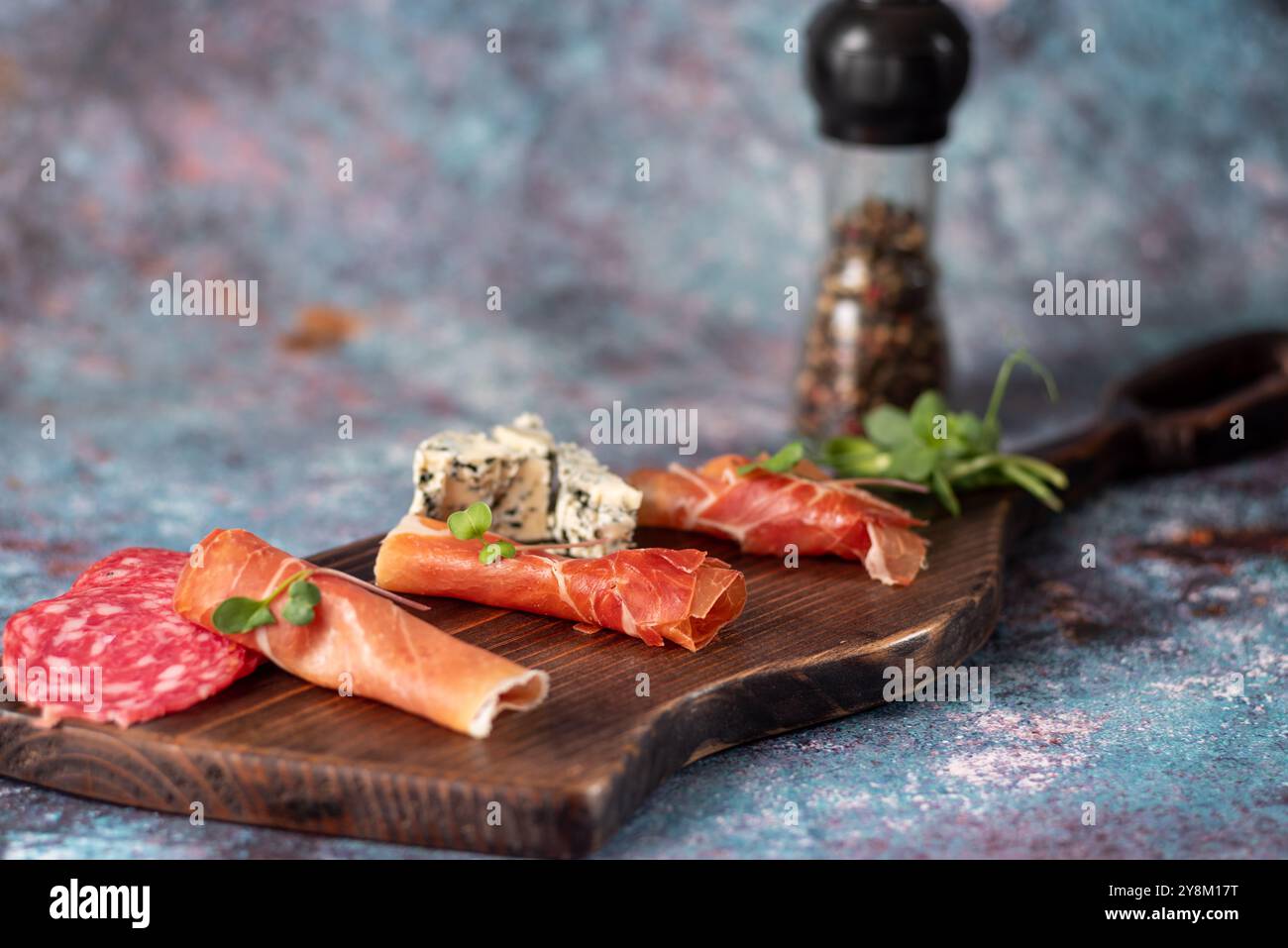 Ham and salami with herbs and spices. Meat cut into slices Stock Photo ...