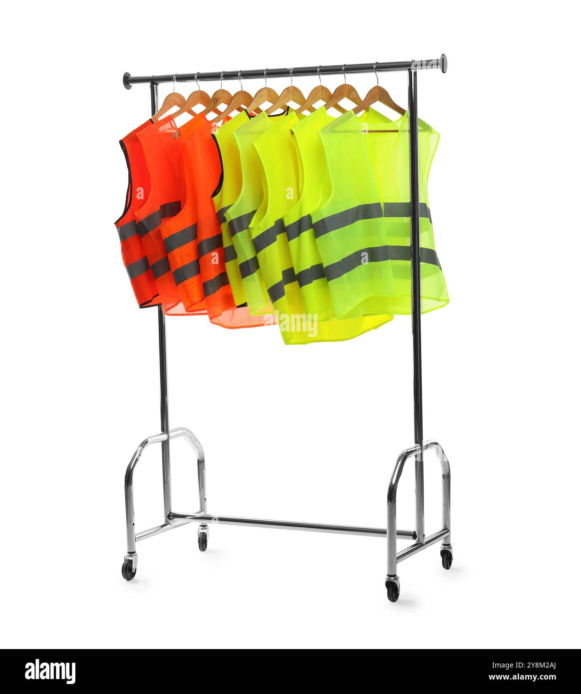 Different bright reflective vests on clothing rack isolated on white ...