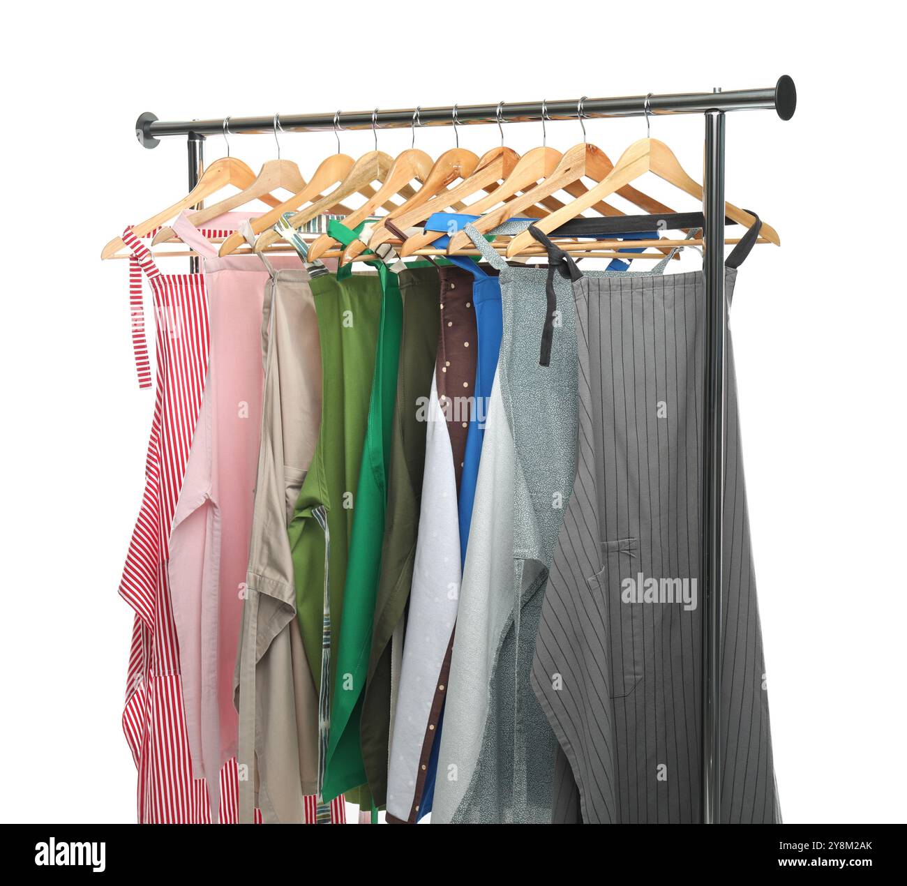 Chef's aprons on clothing rack isolated on white Stock Photo - Alamy