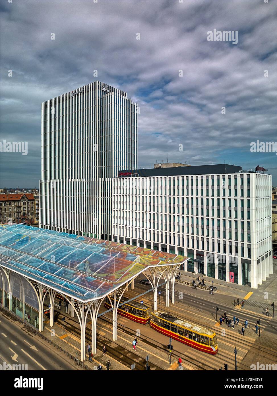 Modern Cityscape in Łódź, Poland, Featuring a Glass-Covered Tram ...