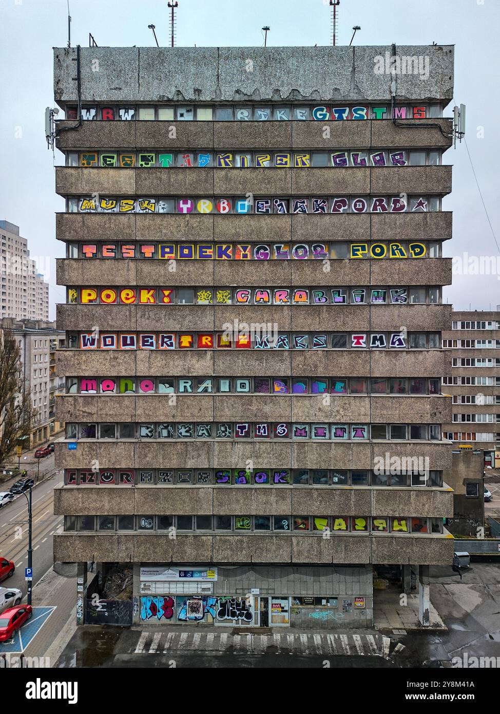 Brutalist Building Covered in Colorful Graffiti on Windows and Facade ...