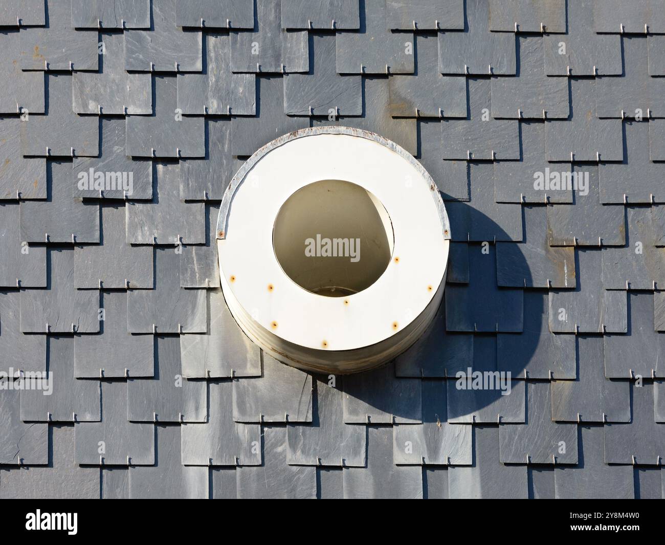 Round ventilation windows on wall covered with slates - La Trimouille ...