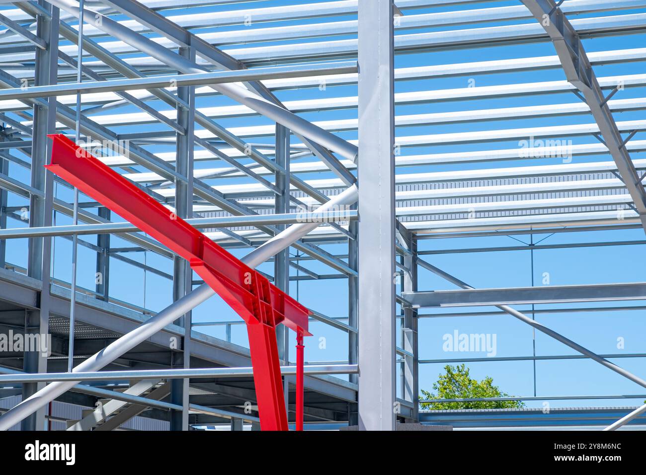 metal structure of an industrial building under construction, metallic ...