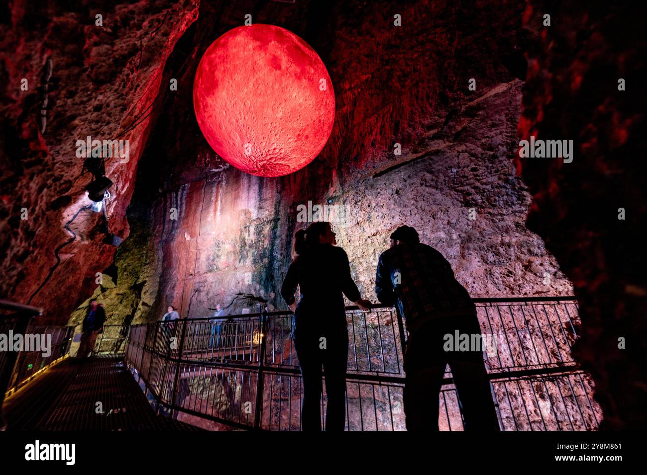 A couple look around Chamber 9 inside Wookey Hole caves, near Wells in ...