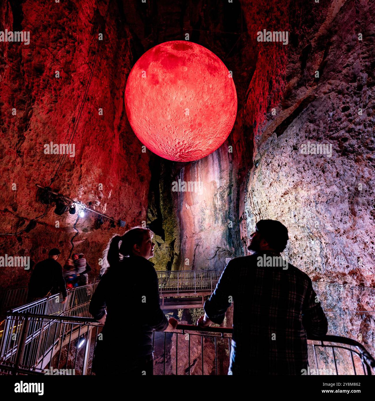A couple look around Chamber 9 inside Wookey Hole caves, near Wells in ...