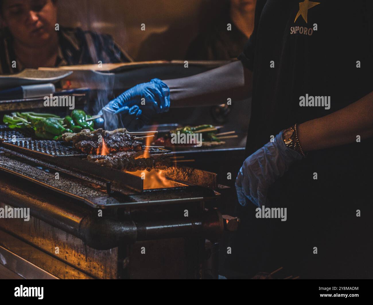 Japanese chef grilling in Omoide Yokocho, Tokyo Stock Photo - Alamy