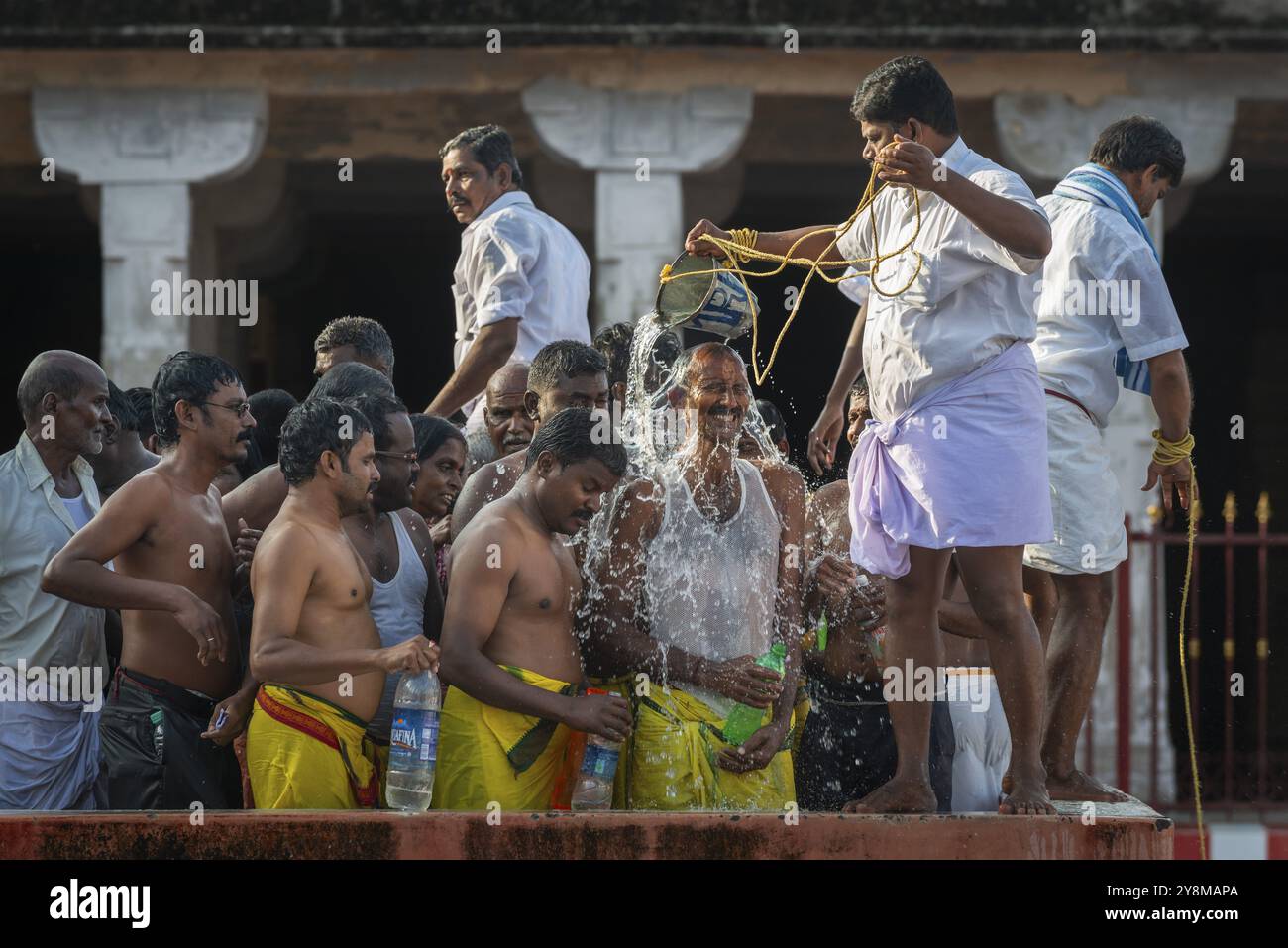 Pilgrims at a washing ritual with 22 stations around the Ramanathaswami ...