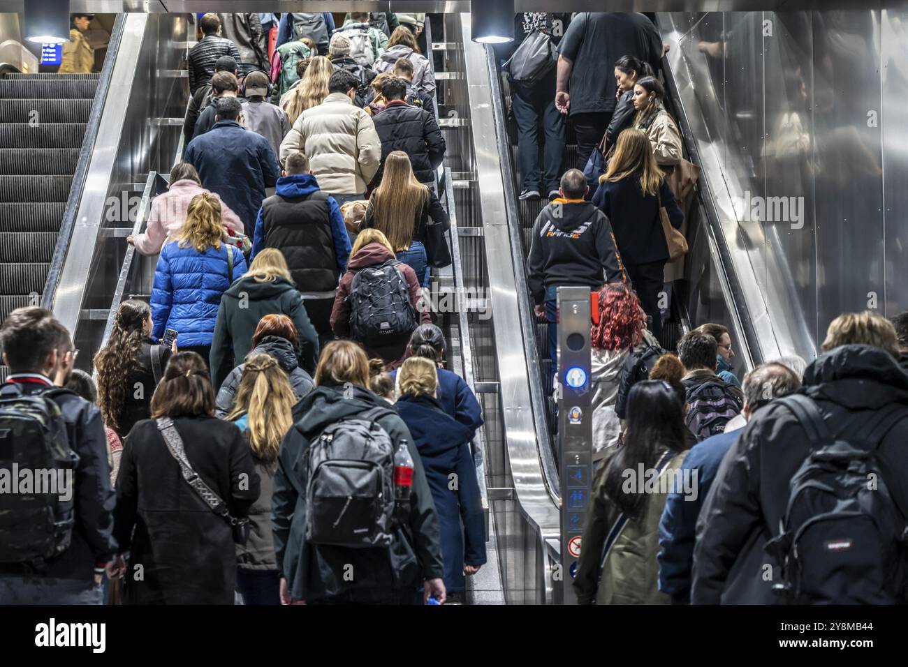 Public transport, underground, main station exit, many people crowding ...