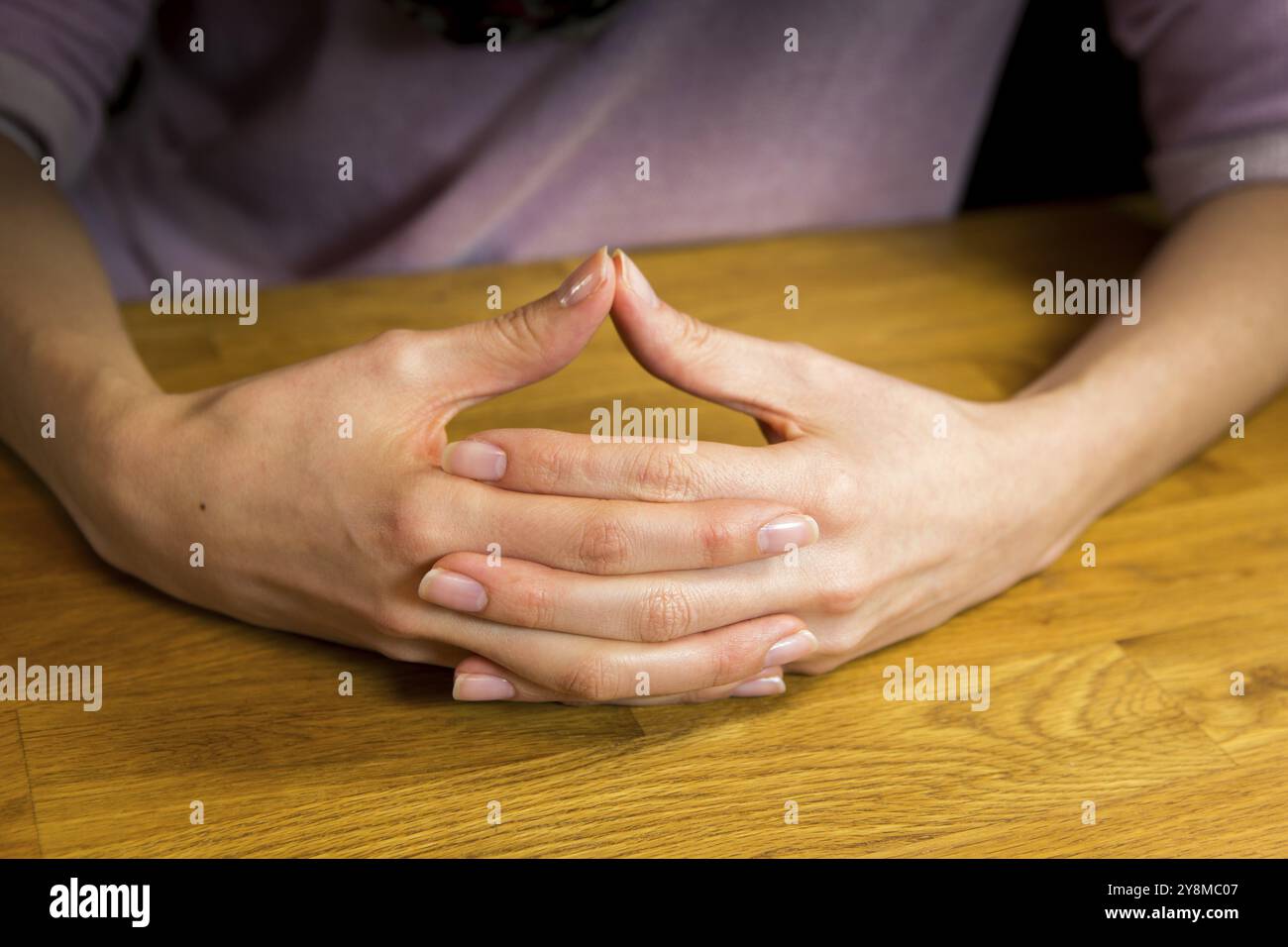 Interlocked female hands Stock Photo - Alamy