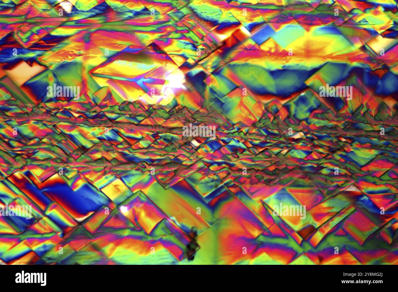 Crystals of Erbium Nitrate under a microscope. The crystals are ...