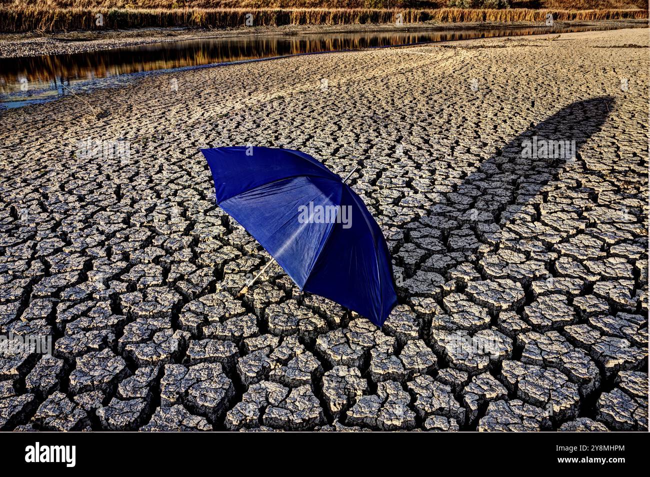 Dry River Bed cracked soil umbrella Canada Drought Stock Photo - Alamy