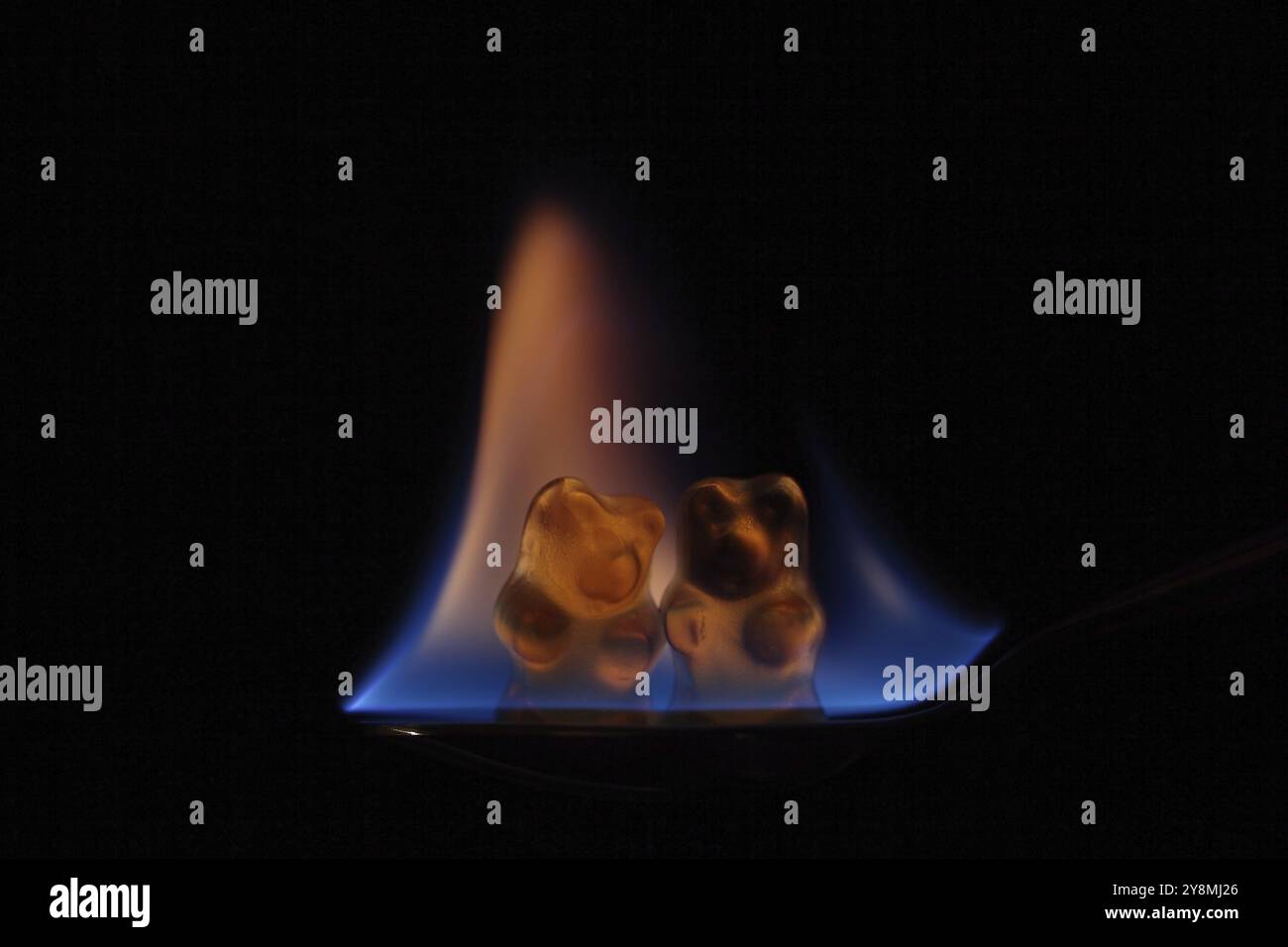 Gummy bears in fire Stock Photo - Alamy