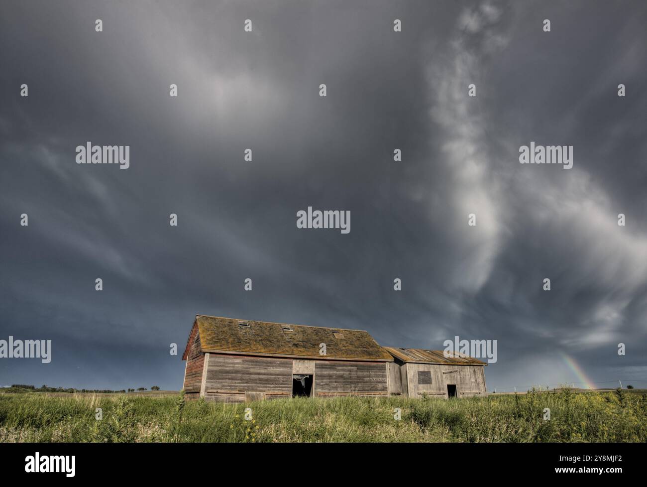 Abandoned Farm with storm clouds in the Canadian Prairie Stock Photo ...