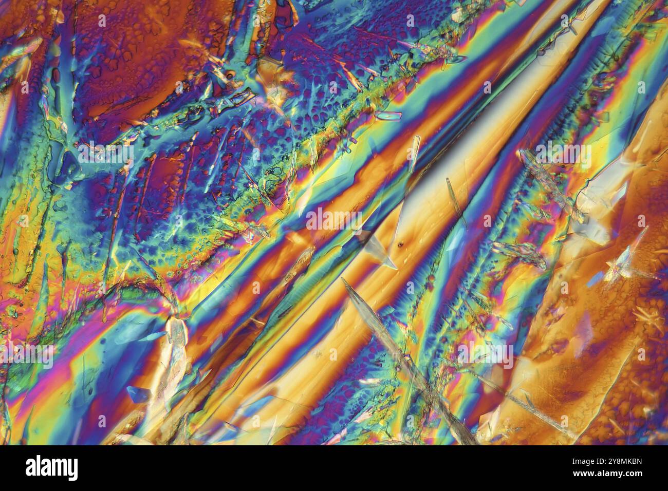 Potassium hydroxide under the microscope and in polarised light Stock ...