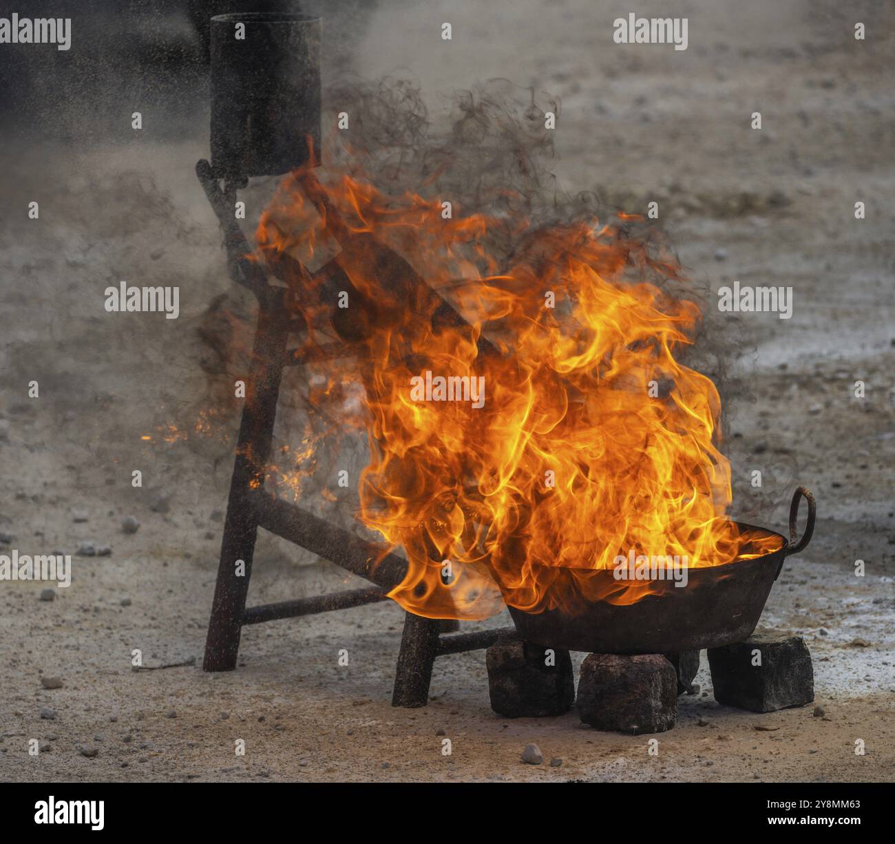 Burning fire and dark smoke in a fire pit Stock Photo - Alamy