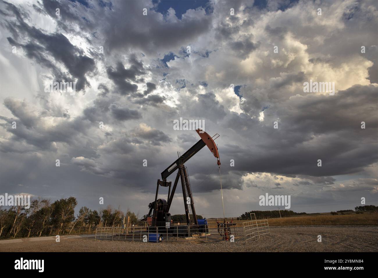 Prairie Storm Clouds Saskatchewan oil pump jack Stock Photo - Alamy