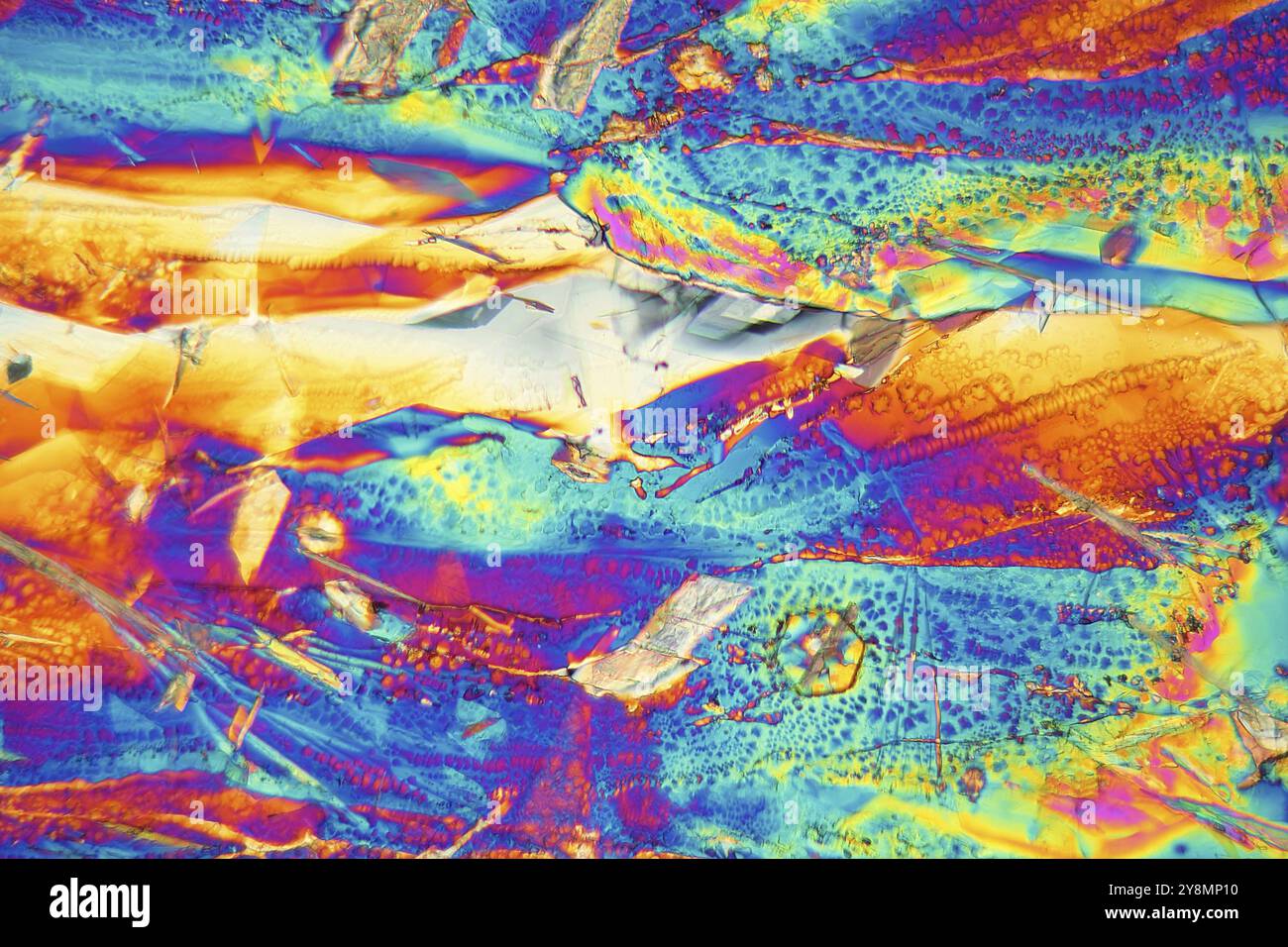 Potassium hydroxide under the microscope and in polarised light Stock ...