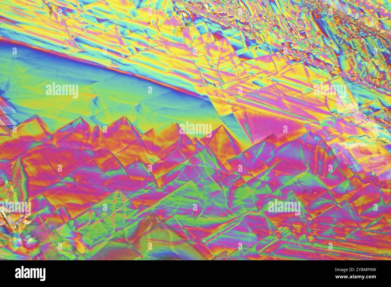 Crystals of Erbium Nitrate under a microscope. The crystals are ...