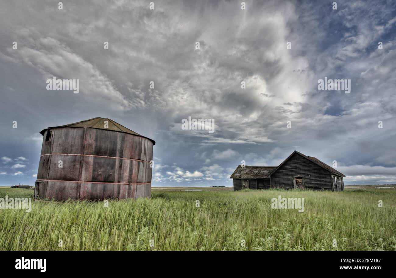 Abandoned Farm with storm clouds in the Canadian Prairie Stock Photo ...