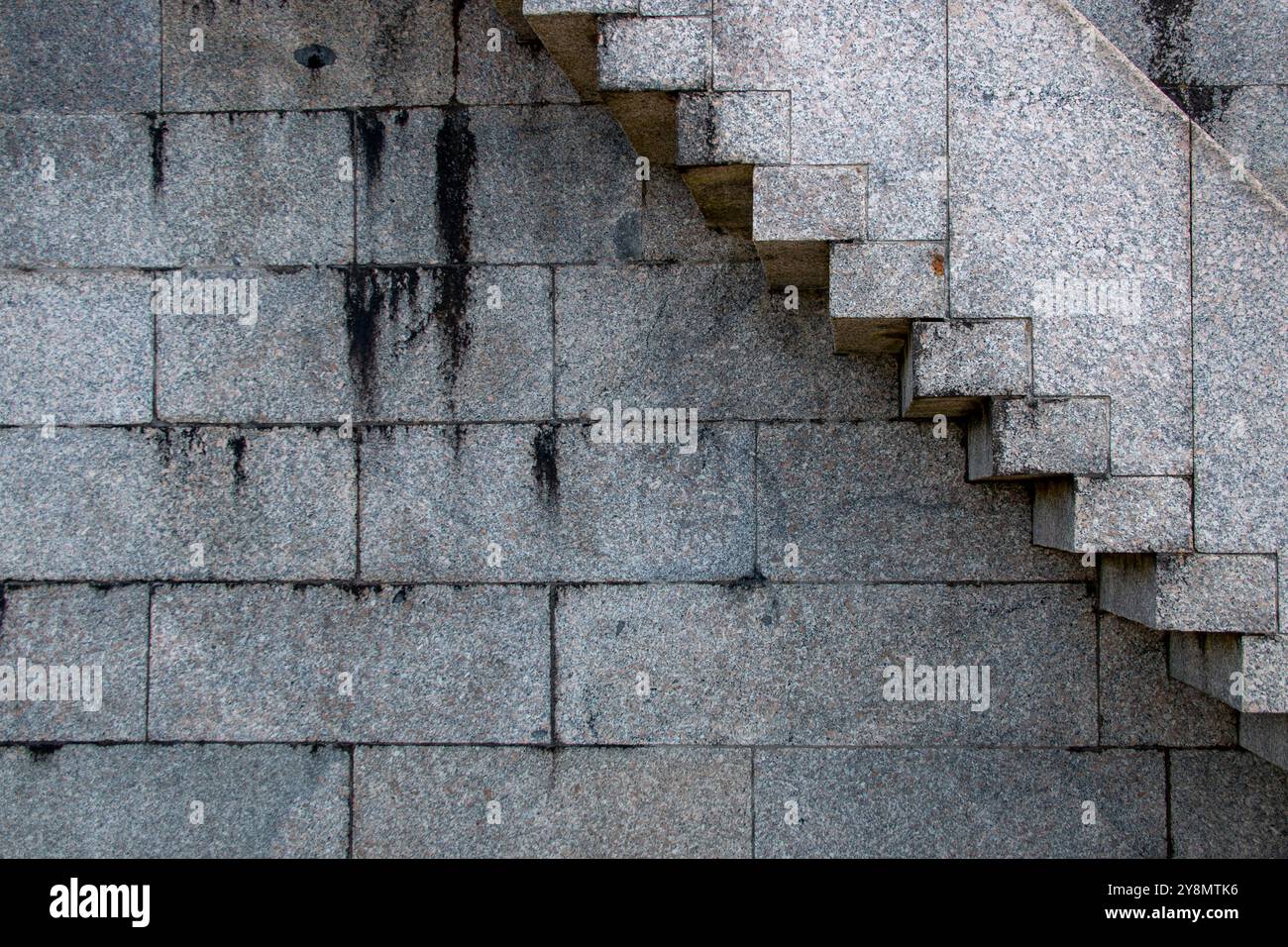 Stone stairs built on a gray granite wall Texture concept Stock Photo ...