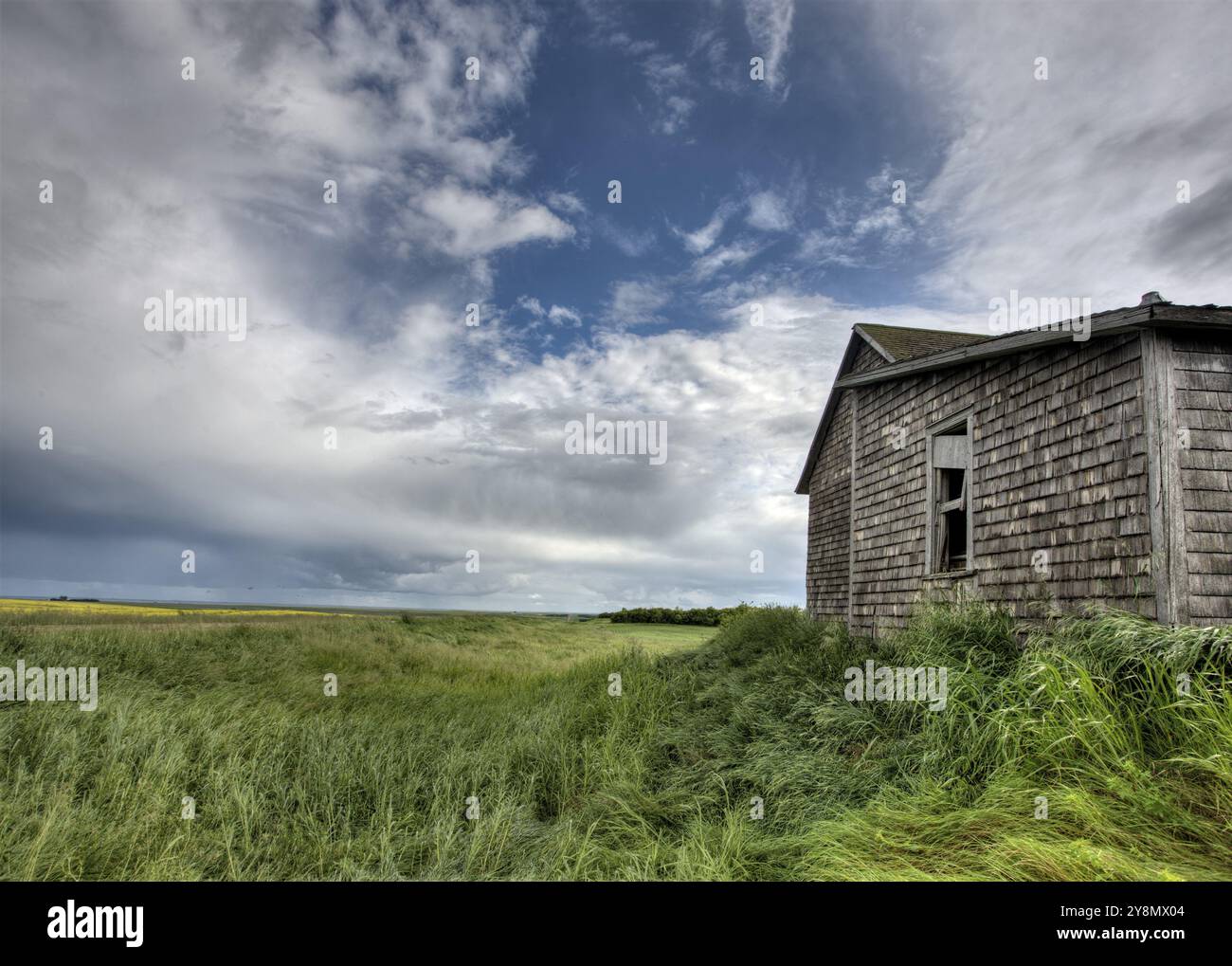 Abandoned Farm with storm clouds in the Canadian Prairie Stock Photo ...