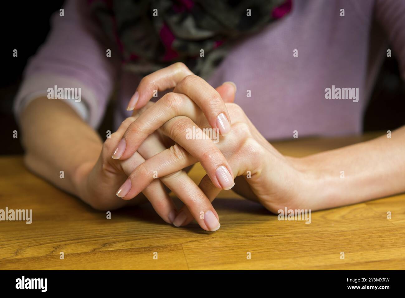 Interlocked female hands Stock Photo - Alamy