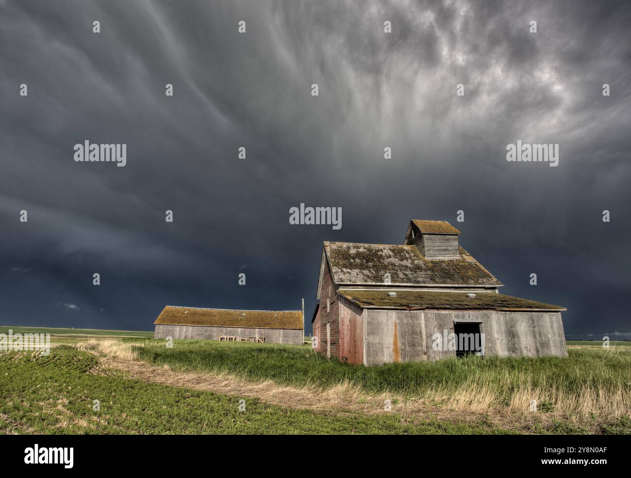 Abandoned Farm with storm clouds in the Canadian Prairie Stock Photo ...