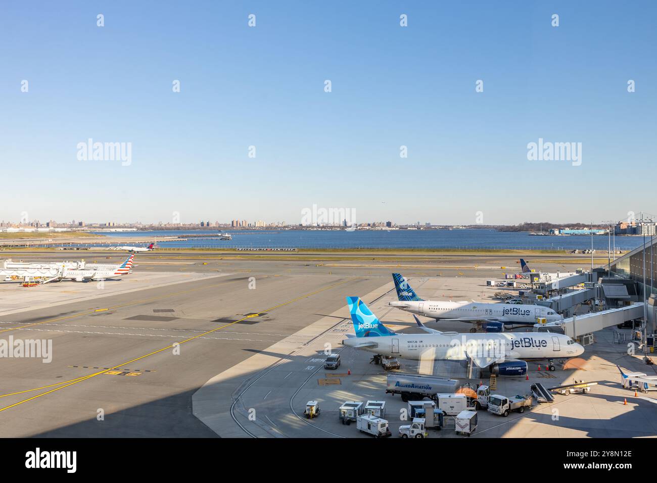 The LaGuardia Airport runway with planes at their gates and a "Welcome ...