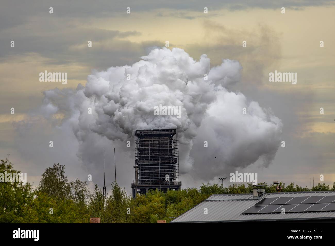 Heavy industry, air pollution, old brick chimney, releasing pollutants ...