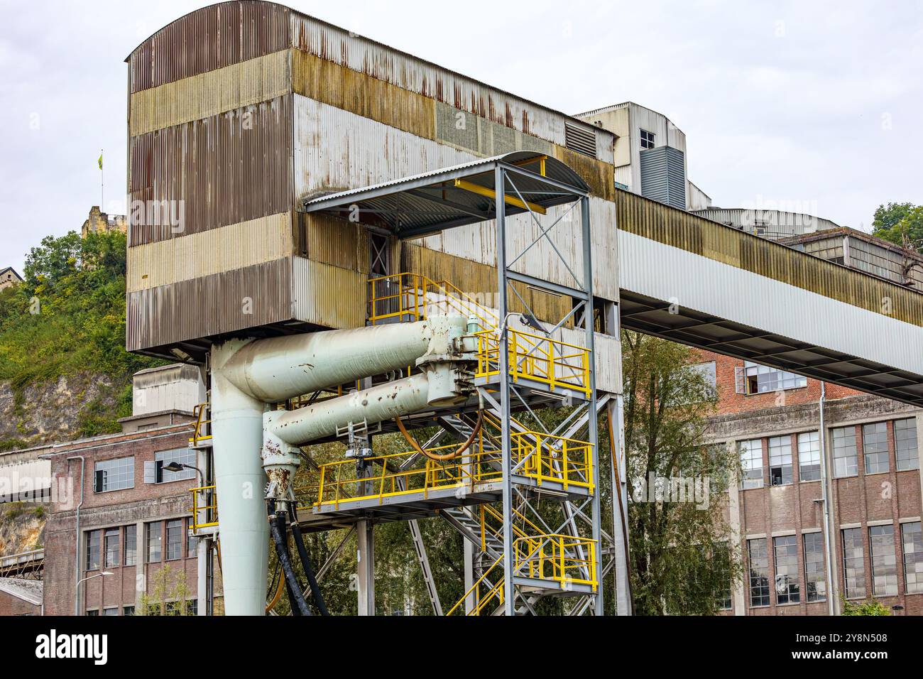 Abandoned and ruined industrial complex with storage tower at bulk ...
