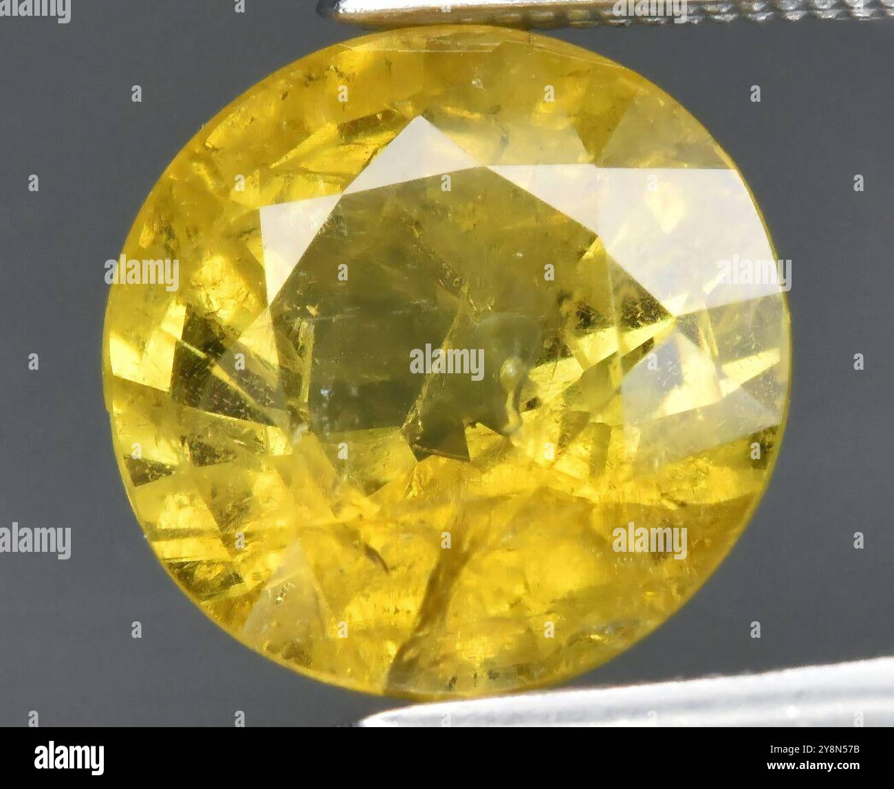 Radiant Yellow Natural Gemstone with Intricate Faceting and Unique ...