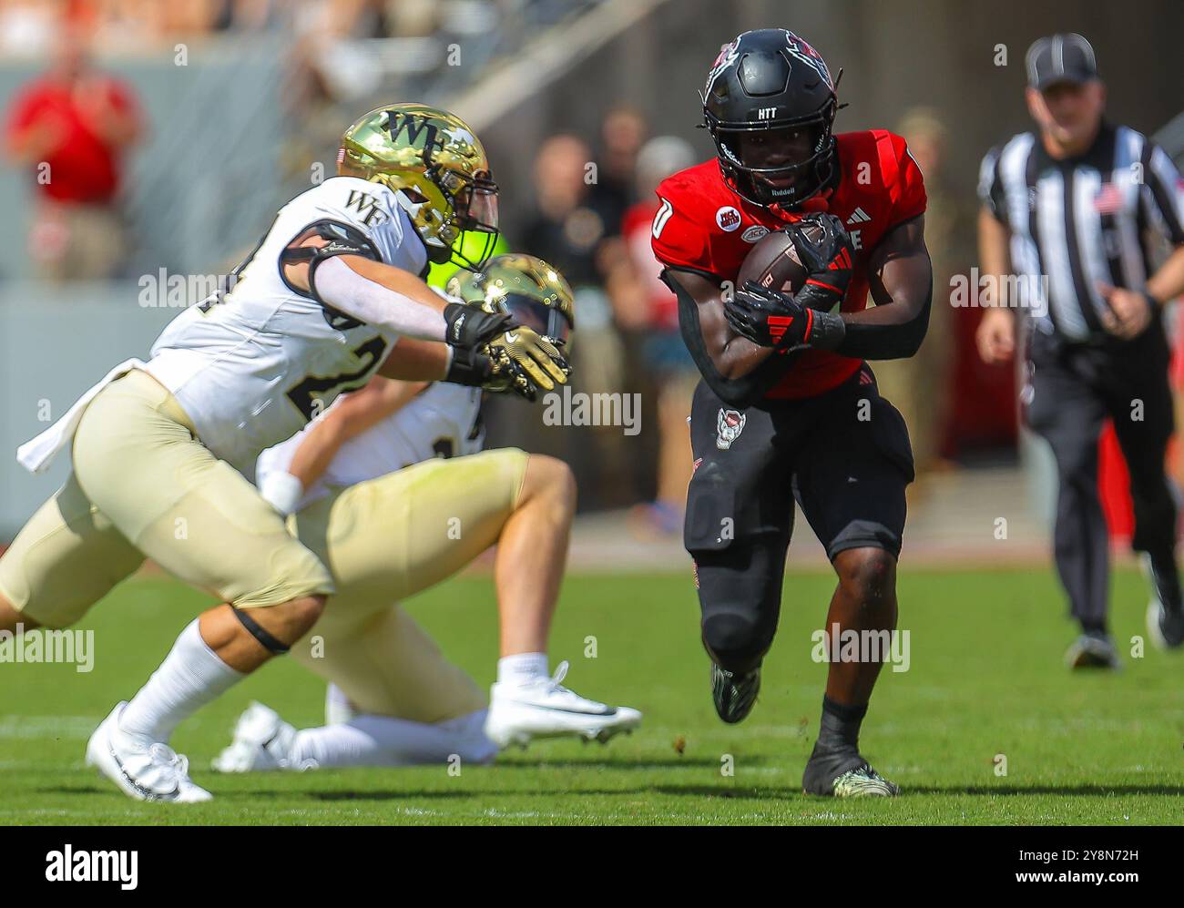 October 5, 2024: Wake Forest junior Dylan Hazen (24) tackles NC State ...